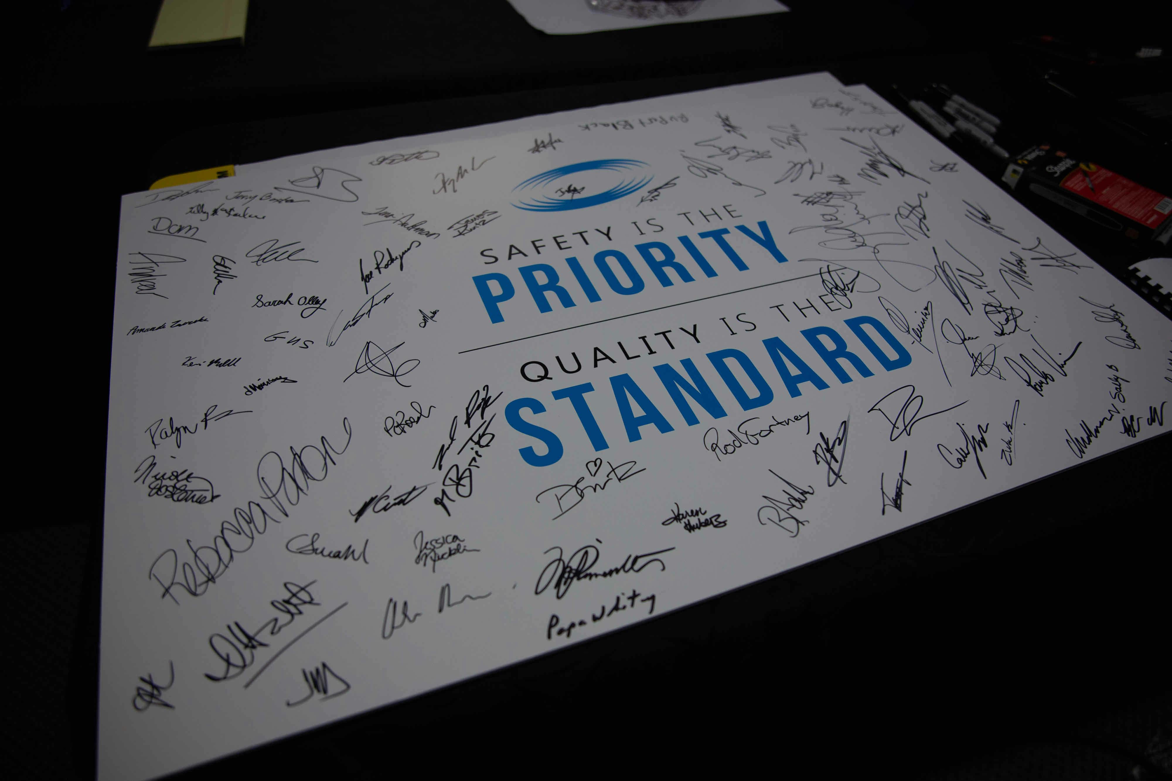 Signed safety poster reading ‘Safety is the Priority, Quality is the ...