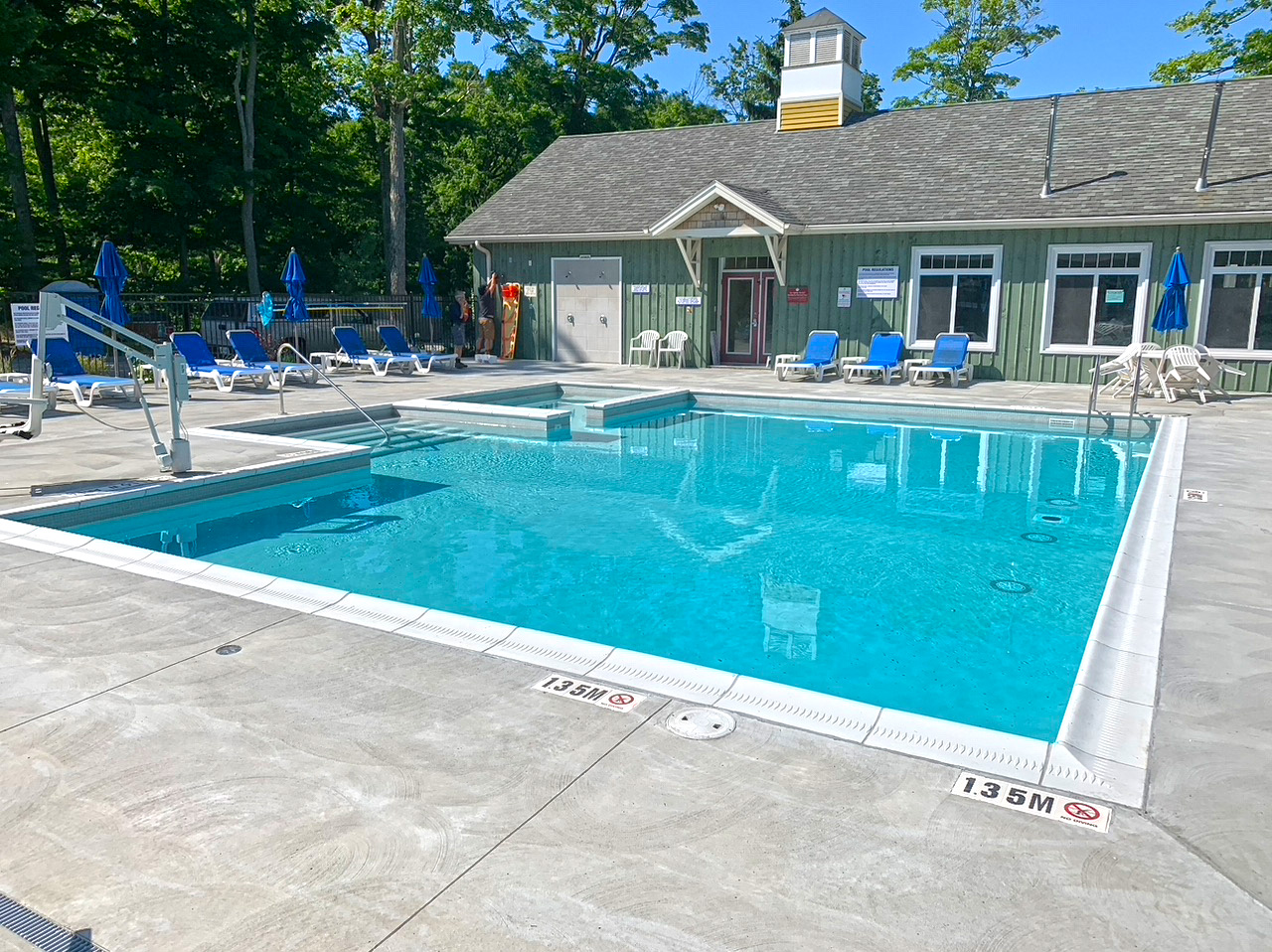An outdoor leisure pool on a sunny day.