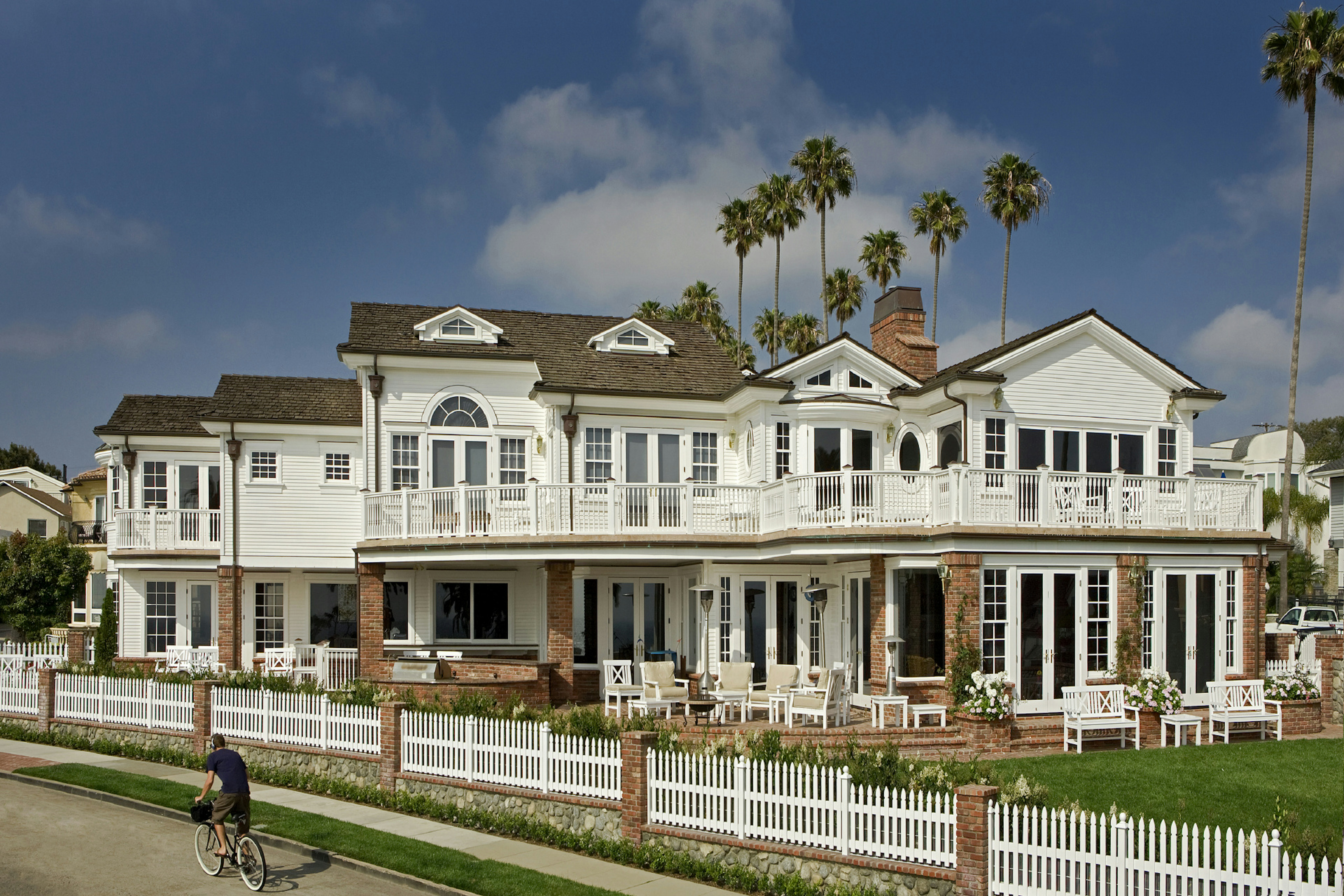 Traditional estate with wood siding and brick on prime coastal property ...