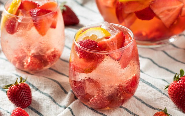 Mixing pink gin and Old Mout Strawberry & Apple cider, this punch is o ...