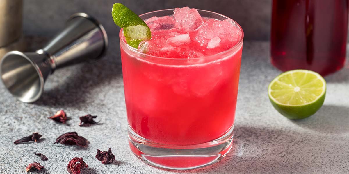 This bright red gin cocktail is made with hibiscus syrup and citrus ...