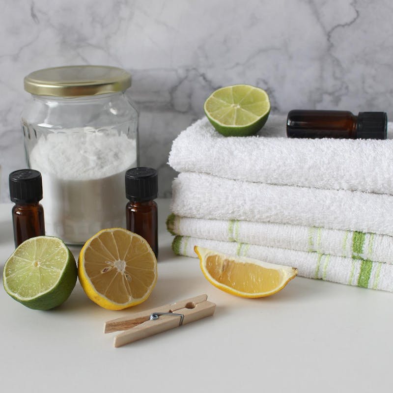 Folded Towels With Baking Soda Essential Oils Limes And Lemons folded-towels-with-baking-soda-essential-oils-limes-and-lemons