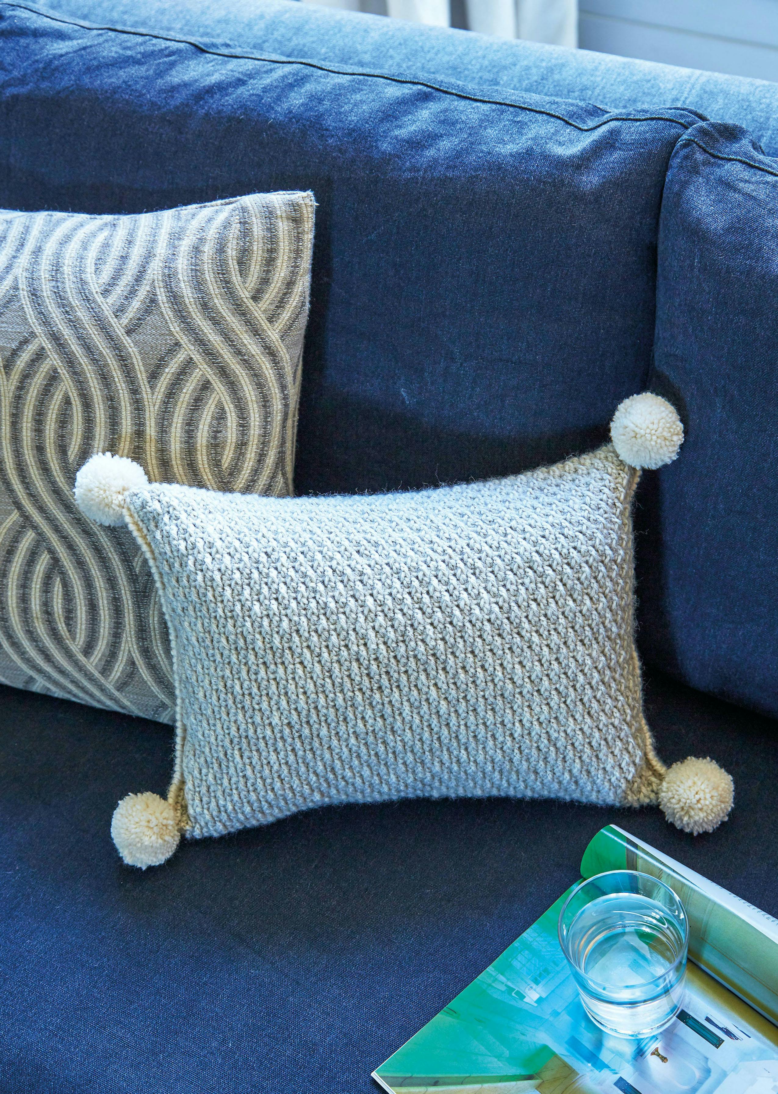 Chic textured pom pom crochet cushion tutorial | LoveCrafts