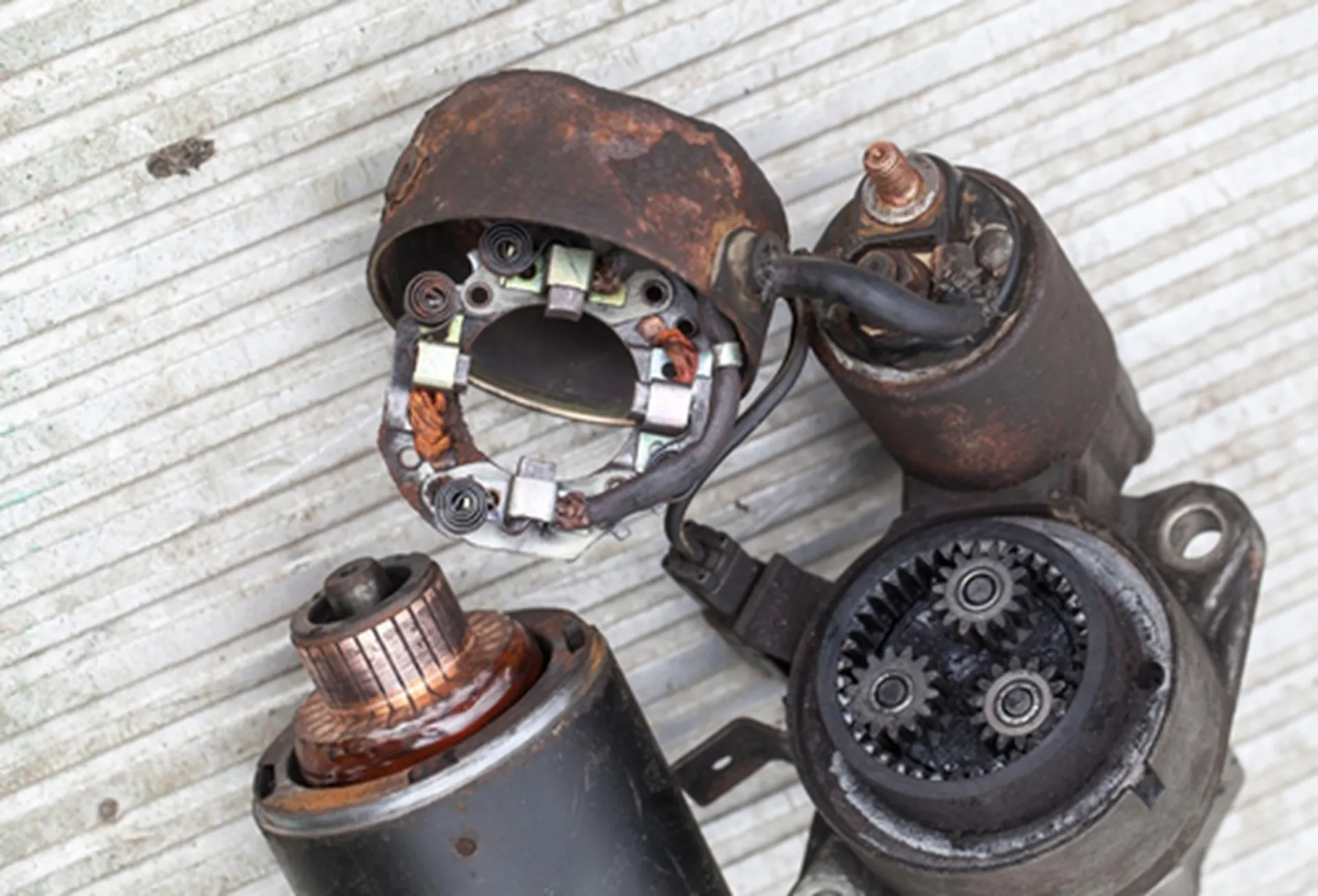 A dismantled starter motor showing the internal components