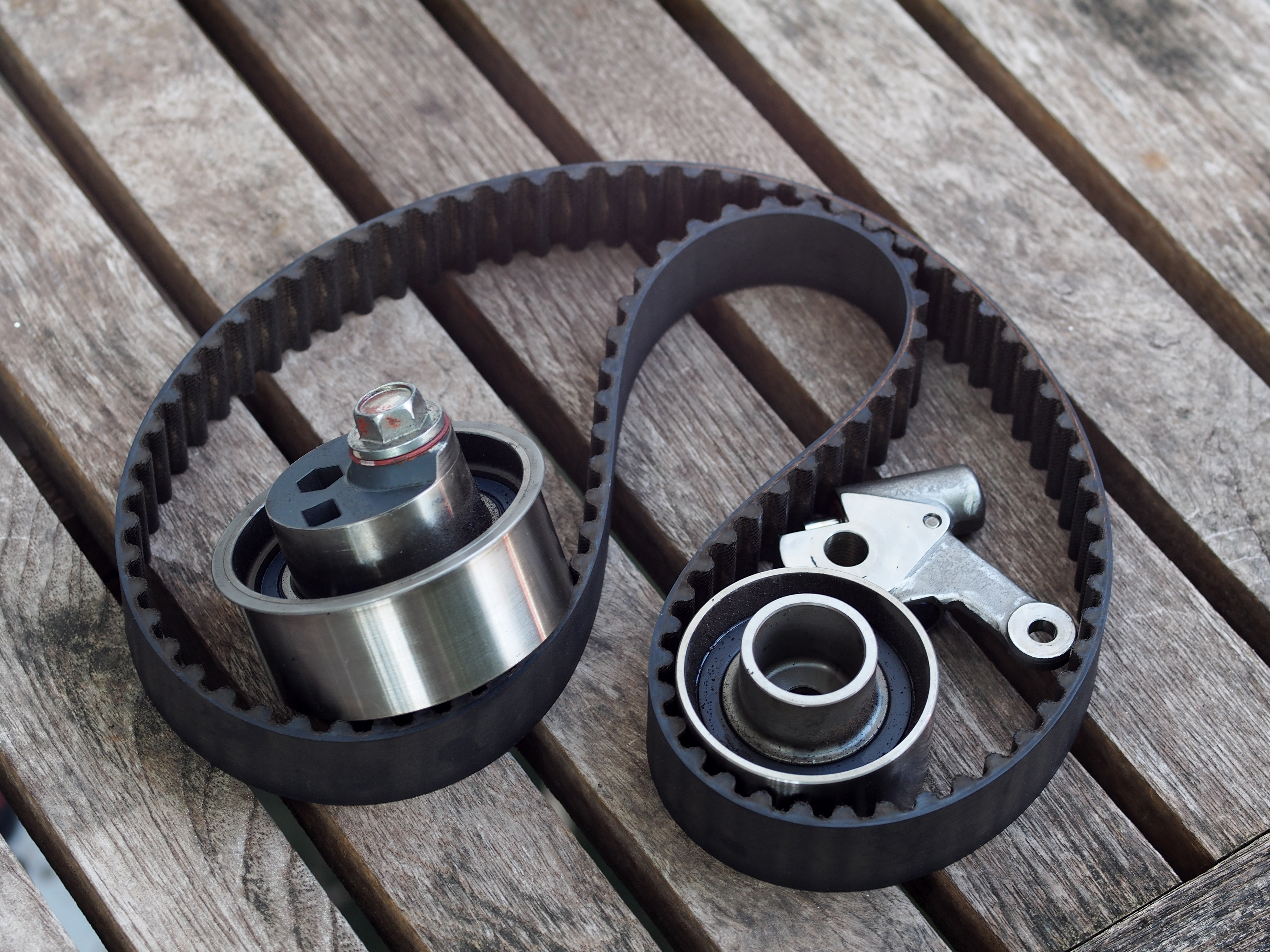 What is a timing belt, and what does it do?