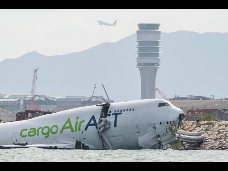 Main wreckage of cargo plane recovered from waters after deadly crash