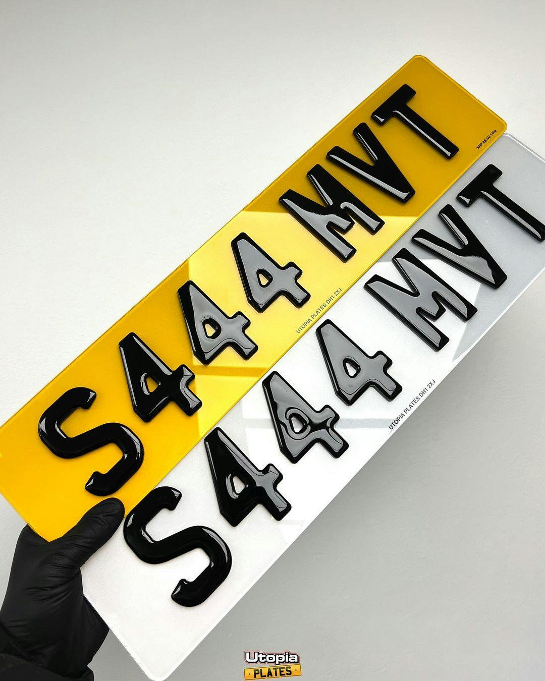 Why are number plates different colours in the UK?